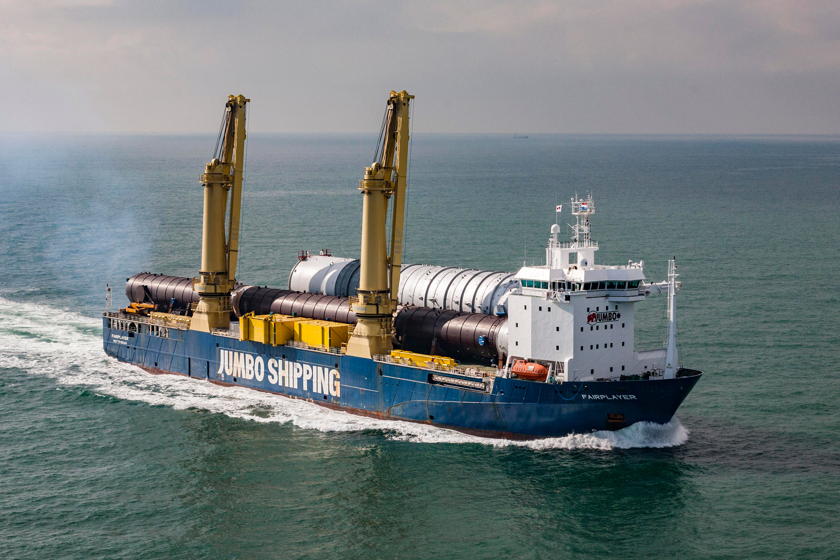 Aerial Of Loaded Heavy Lift Vessel At Sea Aerial Shipping Photography